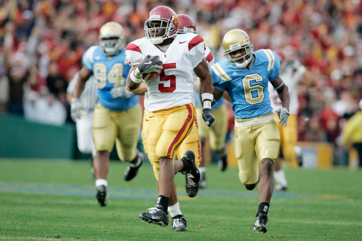USC retires Caleb Williams’ No. 13 beside No. 5 Reggie Bush in Coliseum ...